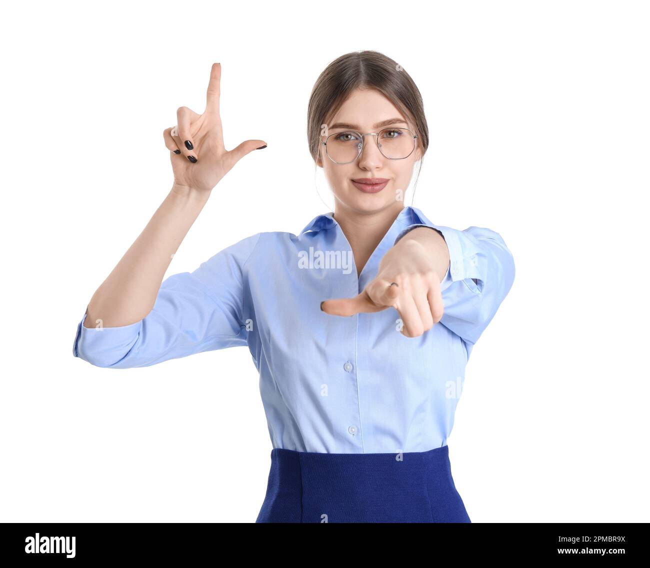 Young businesswoman showing loser gesture and pointing at viewer on ...