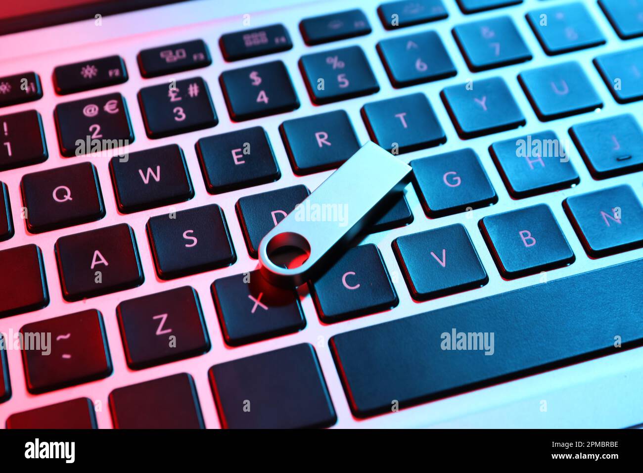 Metallic USB flash drive on modern laptop, closeup Stock Photo - Alamy