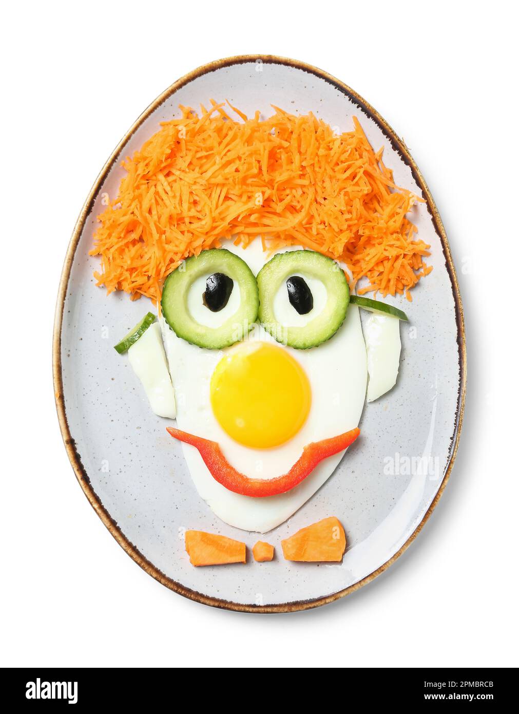Plate with funny children's breakfast in shape of clown isolated on ...