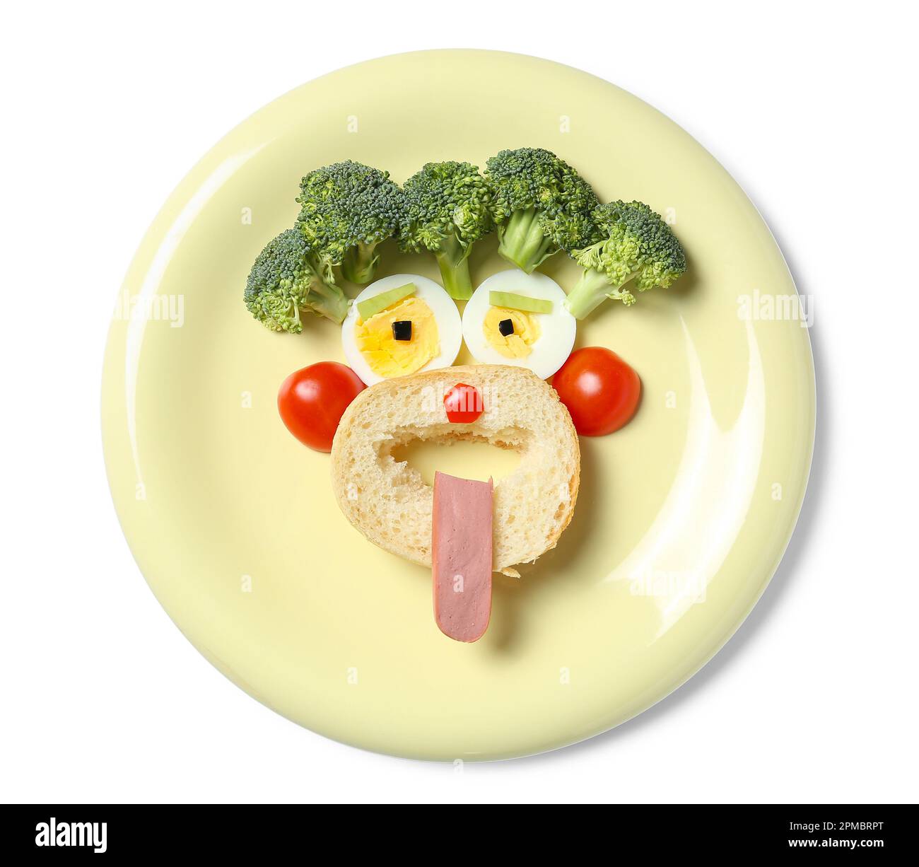 Plate with funny children's breakfast in shape of face isolated on ...