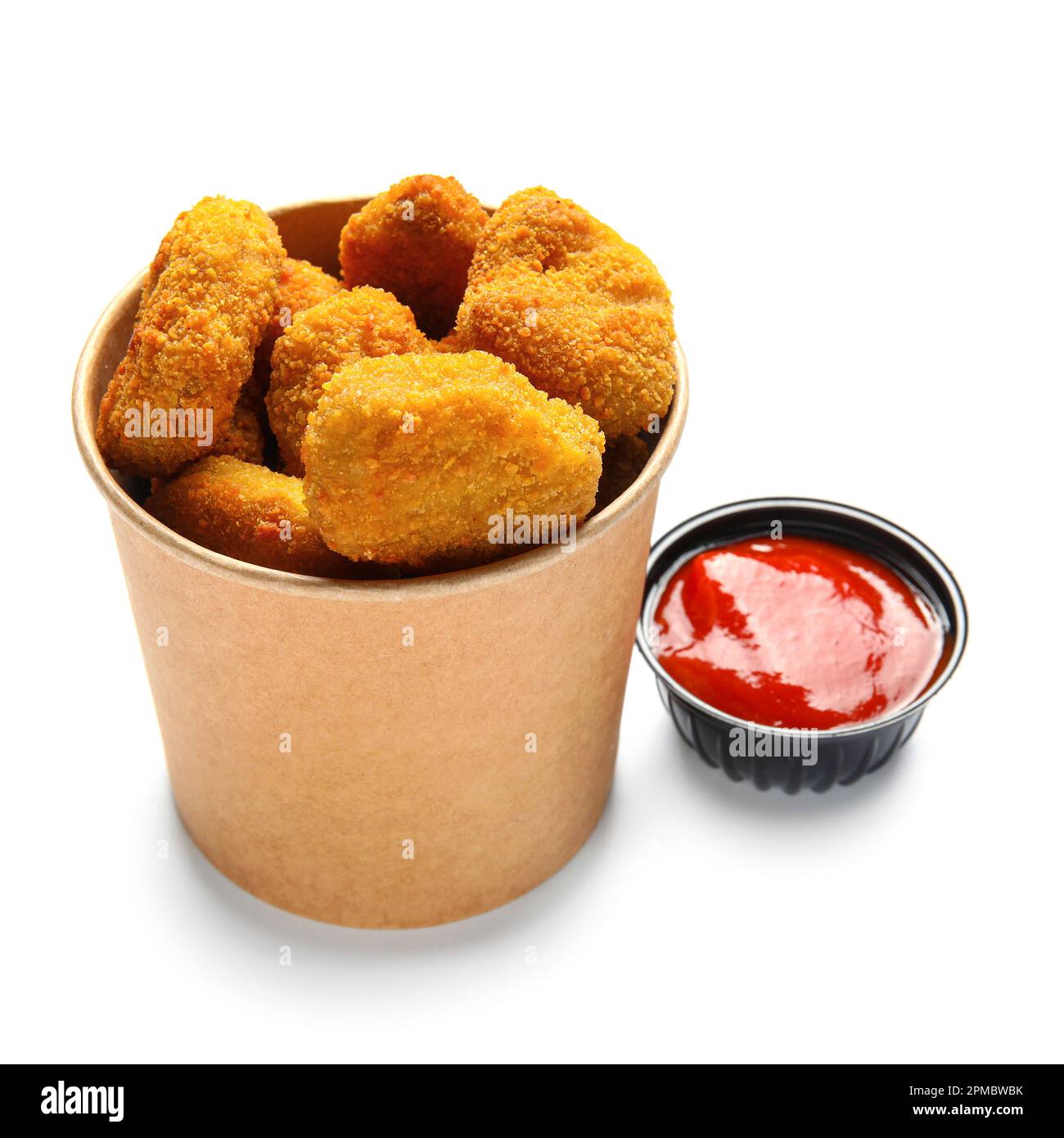Bucket of tasty nuggets with ketchup on white background Stock Photo ...