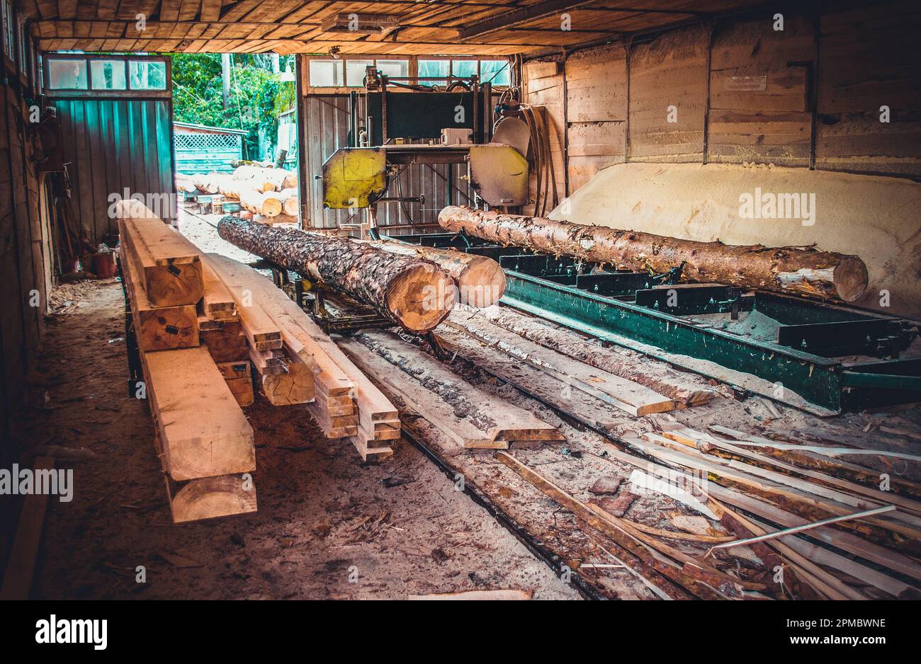 Sawmill. Process of machining logs in equipment sawmill machine saw ...