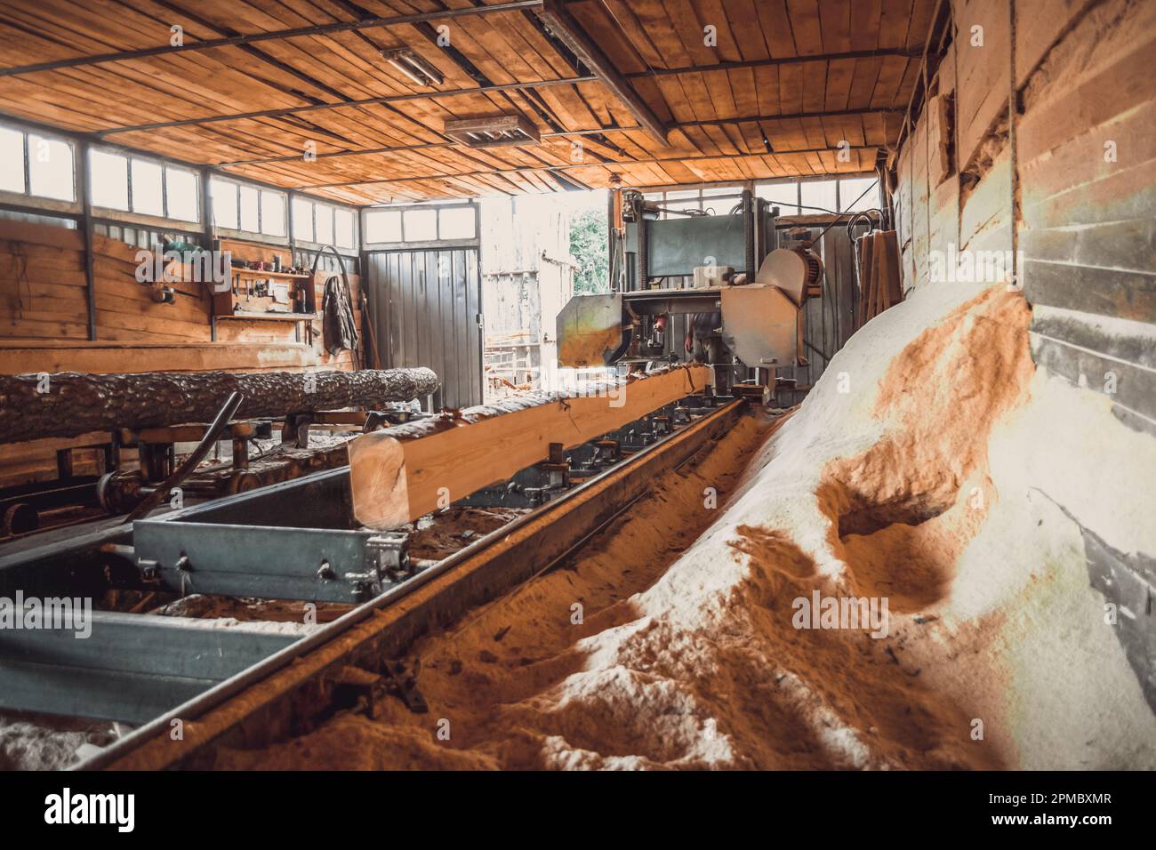 Sawmill. Process of machining logs in equipment sawmill machine saw ...