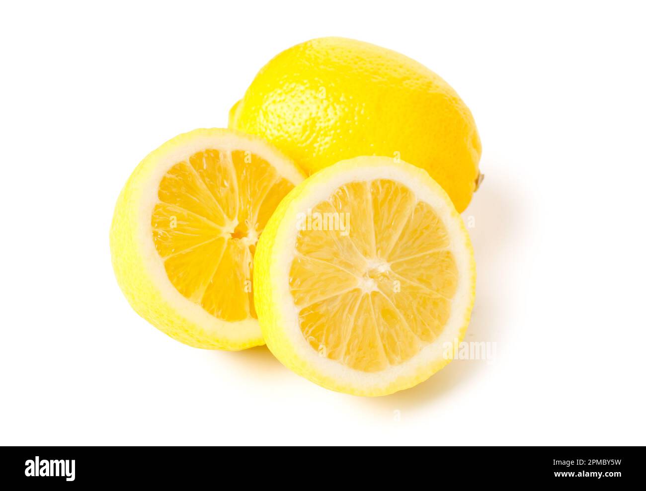 Whole and cut fresh lemons on white background Stock Photo - Alamy