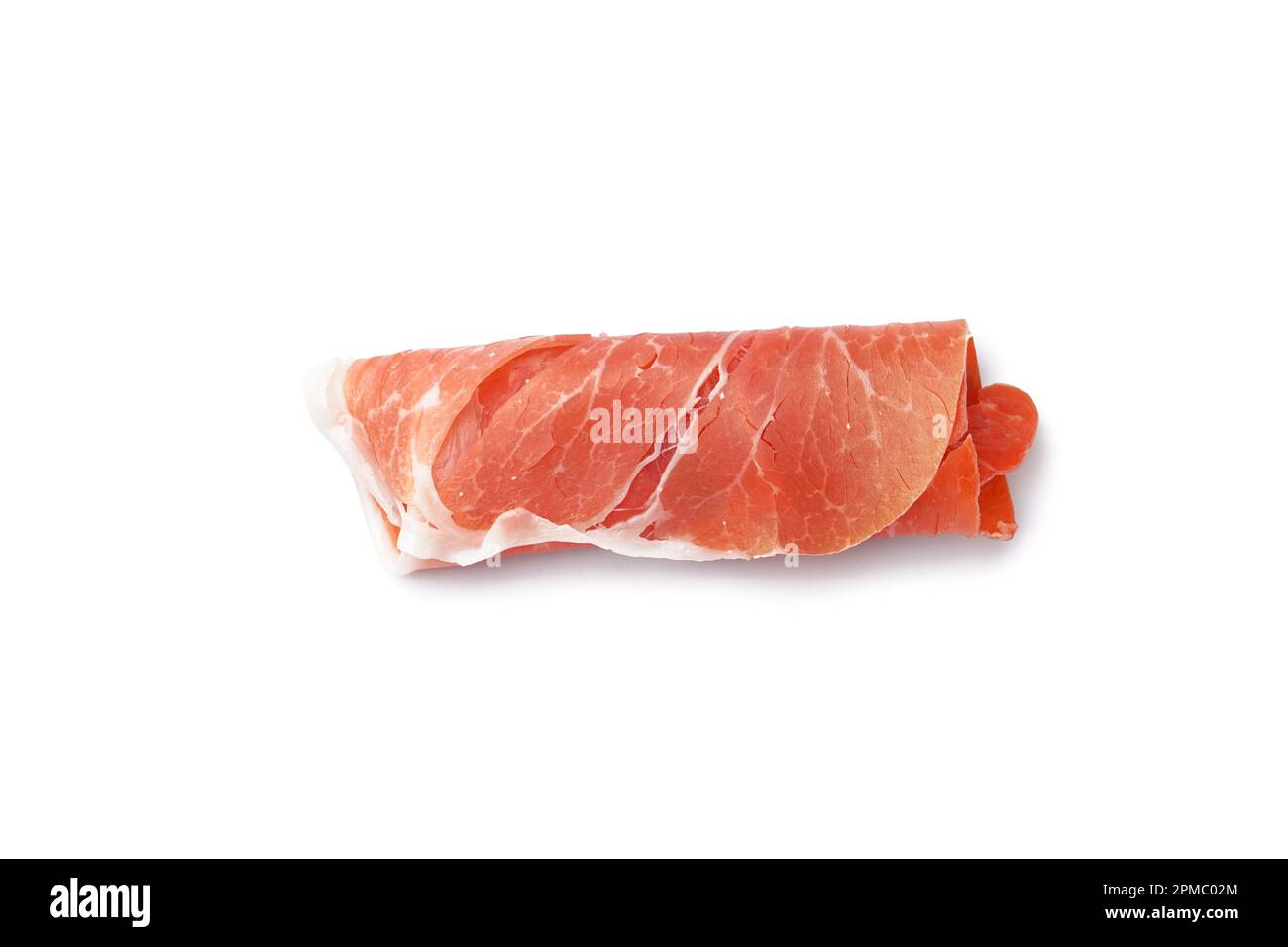 Tasty jamon slice on white background Stock Photo - Alamy