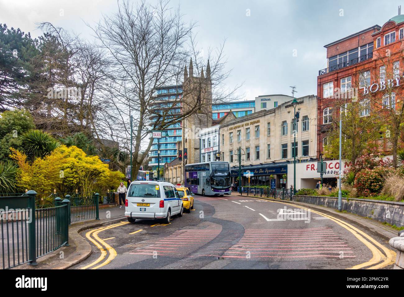 A view along Gervis Place in Bournemouth, Dorset, UK with taxis parked ...