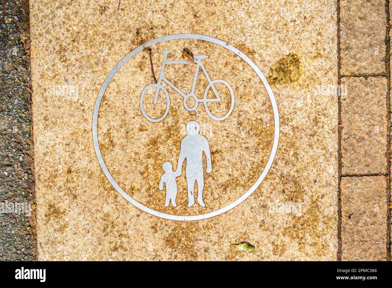 Symbols on the floor, embossed into a pathway inform people that the ...