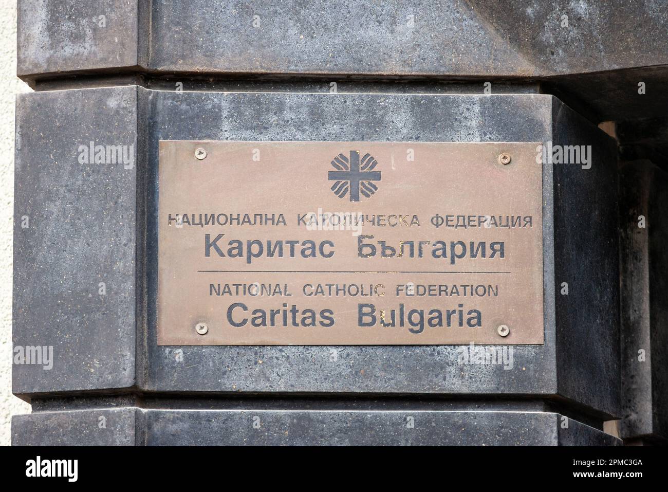 Bilingual sign for the National Catholic Federation Caritas Bulgaria in ...