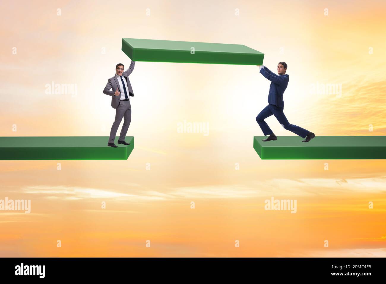 Concept of teamwork with the bridge being built Stock Photo - Alamy