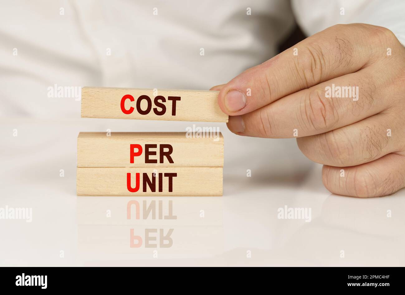 Business concept. In the hands of a person and on a reflective surface ...