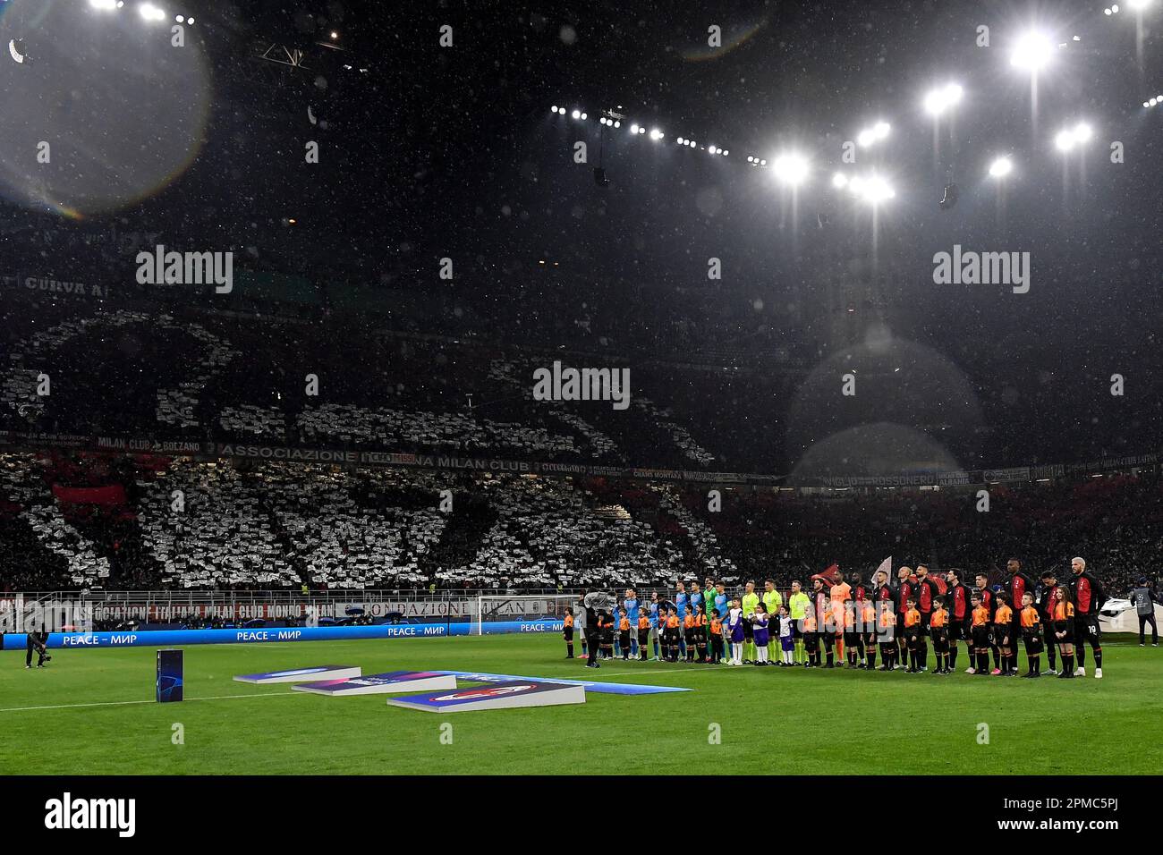 Milan, Italy. 12th Apr, 2023. Teams line up as Milan fans show a ...