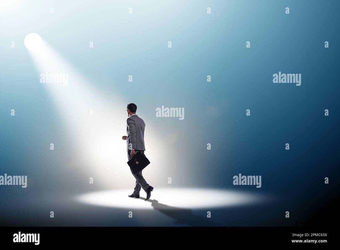 Business people under the spotlight concept Stock Photo - Alamy