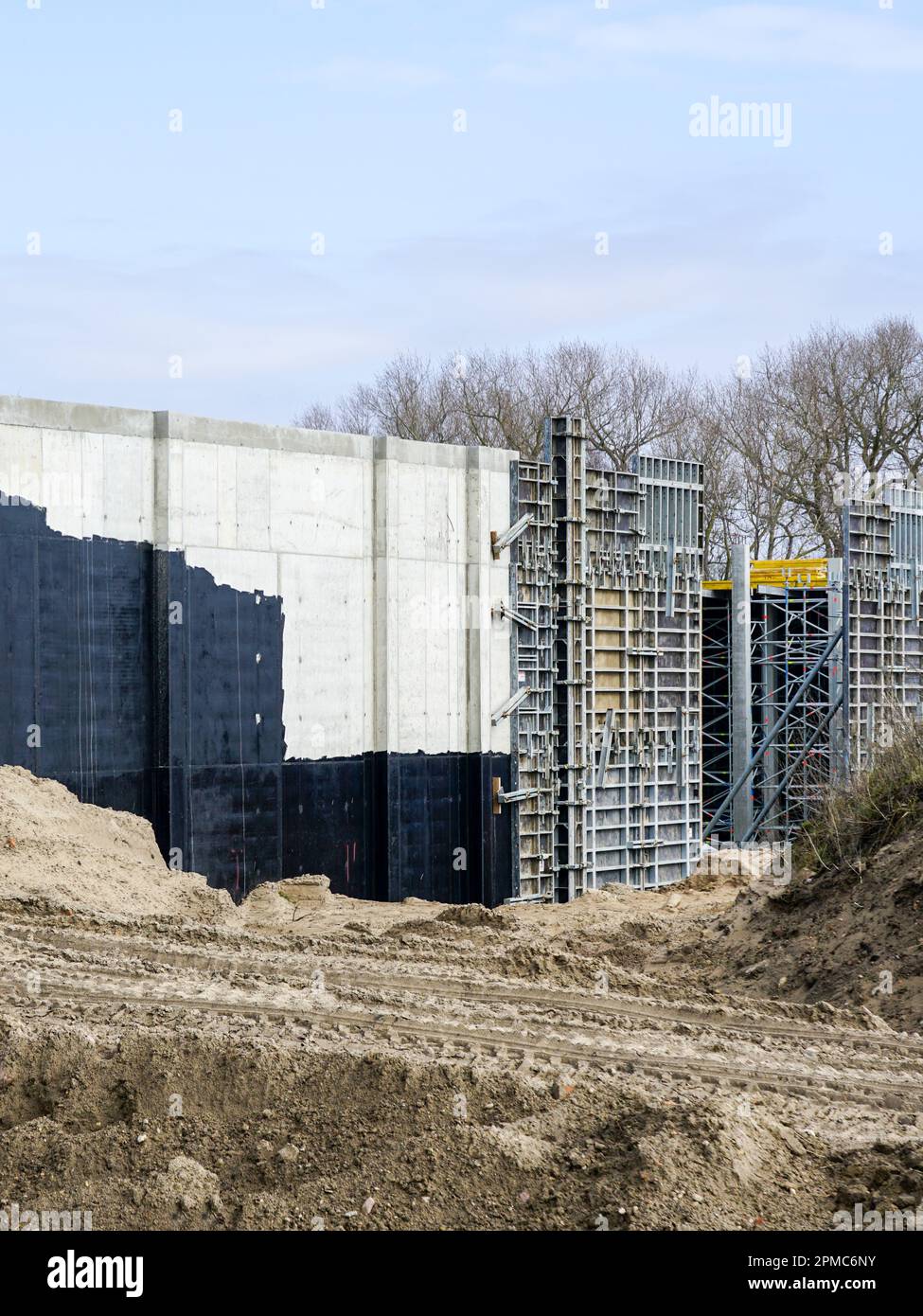Concrete wall of a huge water reservoir built using concrete formwork ...
