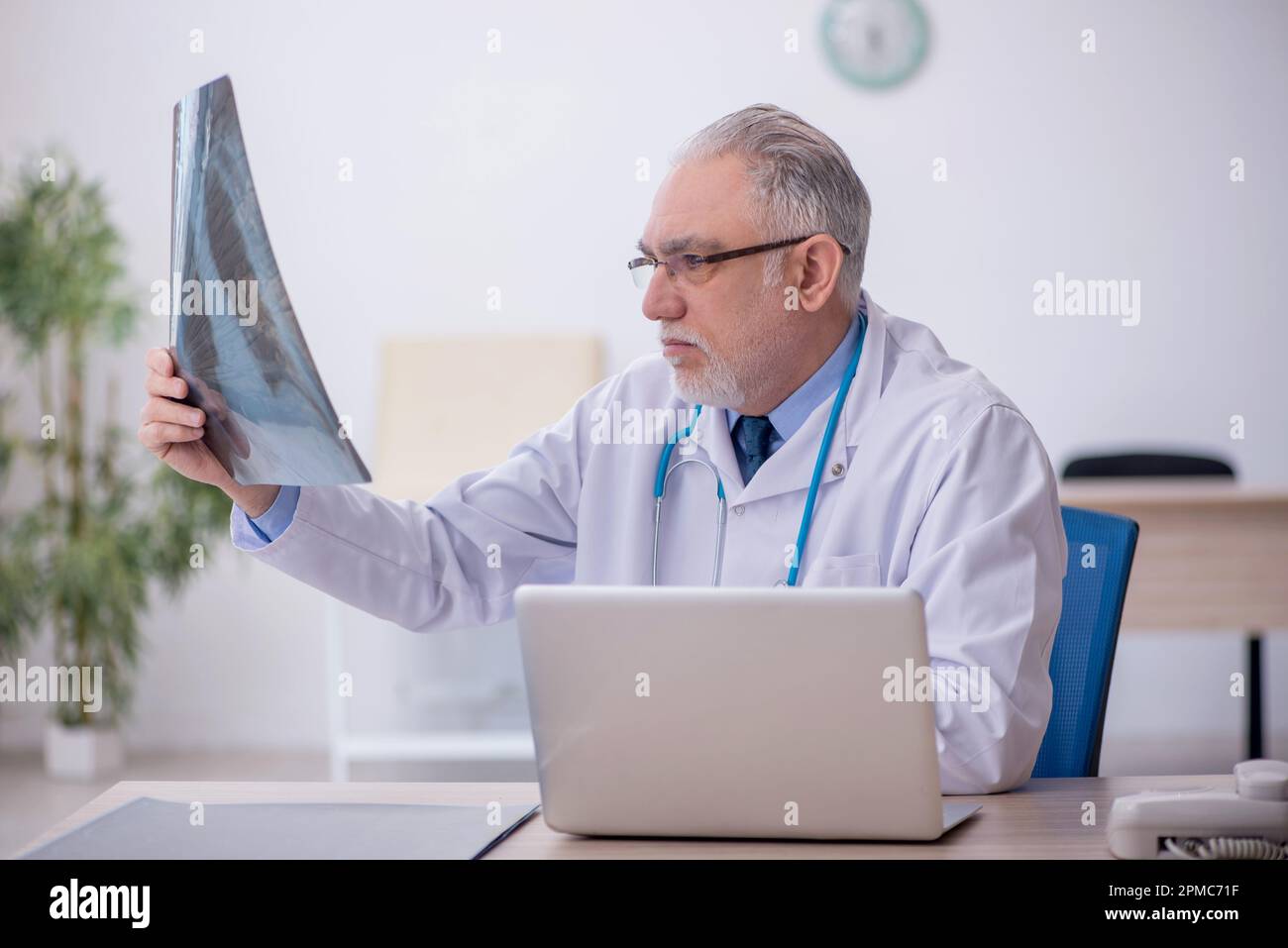 Old doctor radiologist working at the hospital Stock Photo - Alamy