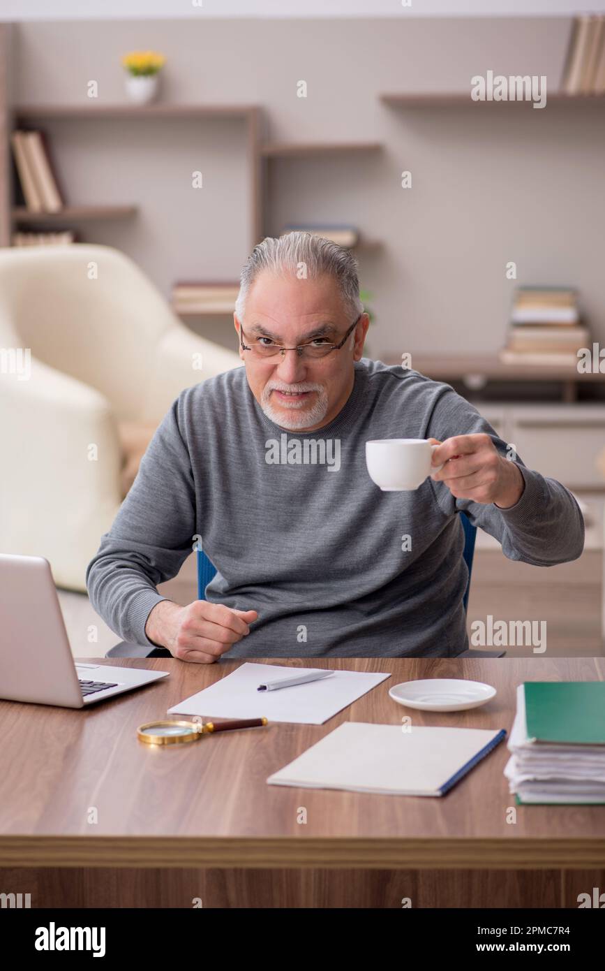 Old employee working from home during pandemic Stock Photo - Alamy