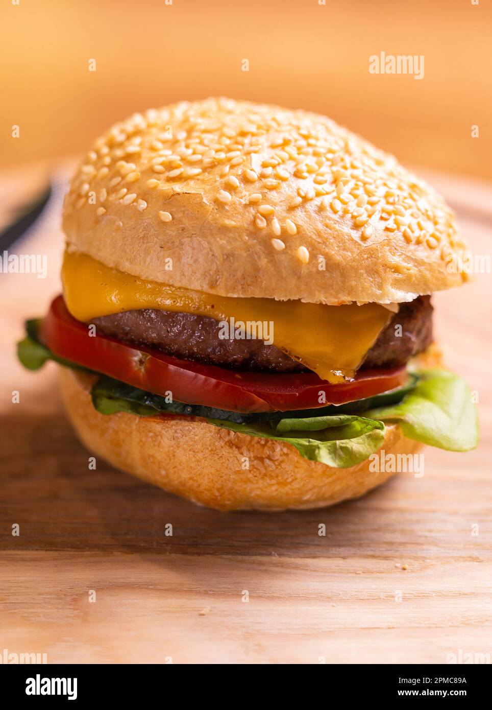Beef burgers on wooden desk. Fat unhealthy food close-up Stock Photo ...