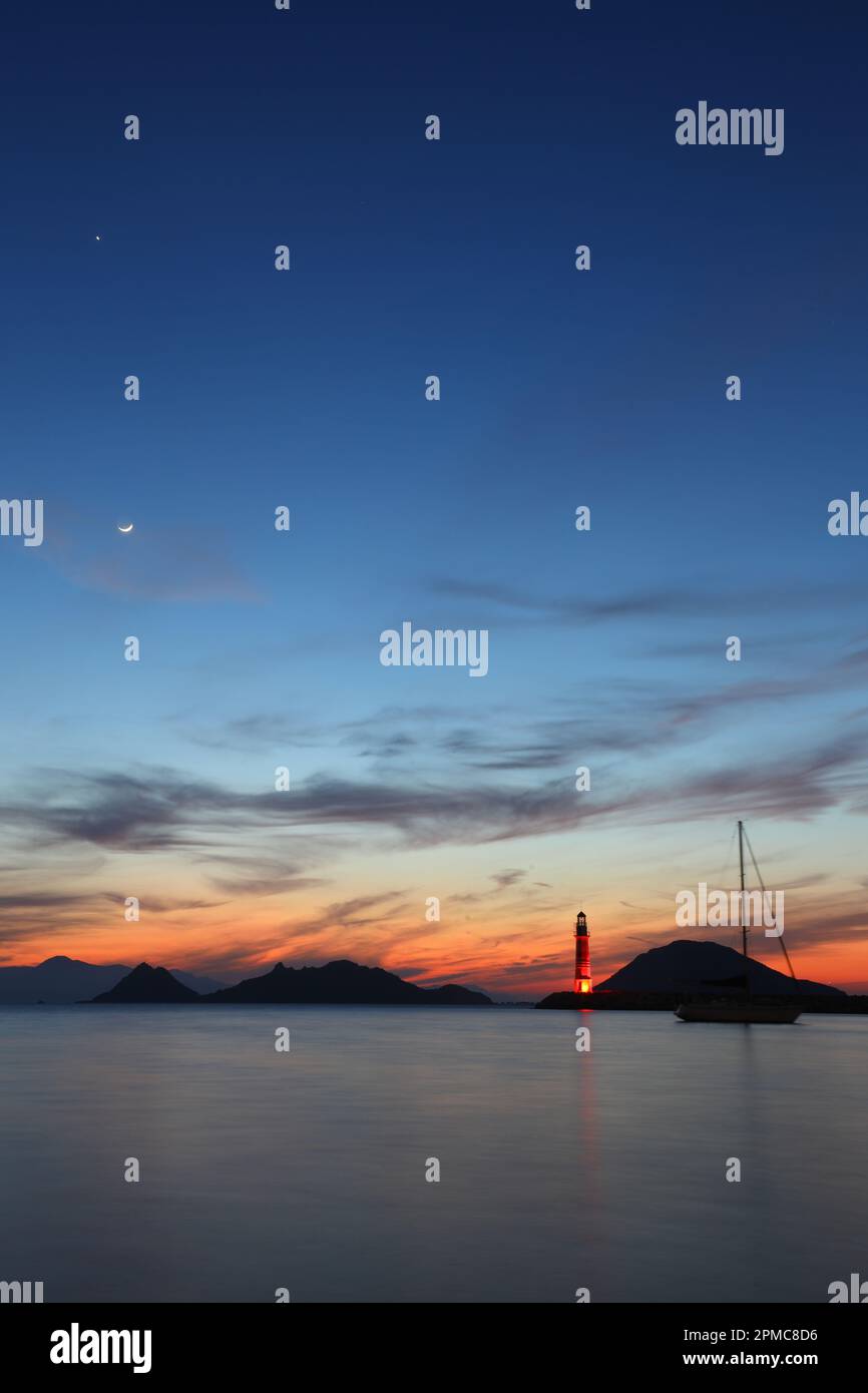 Seascape at sunshine. Lighthouse and sailings on the coast. Seaside ...