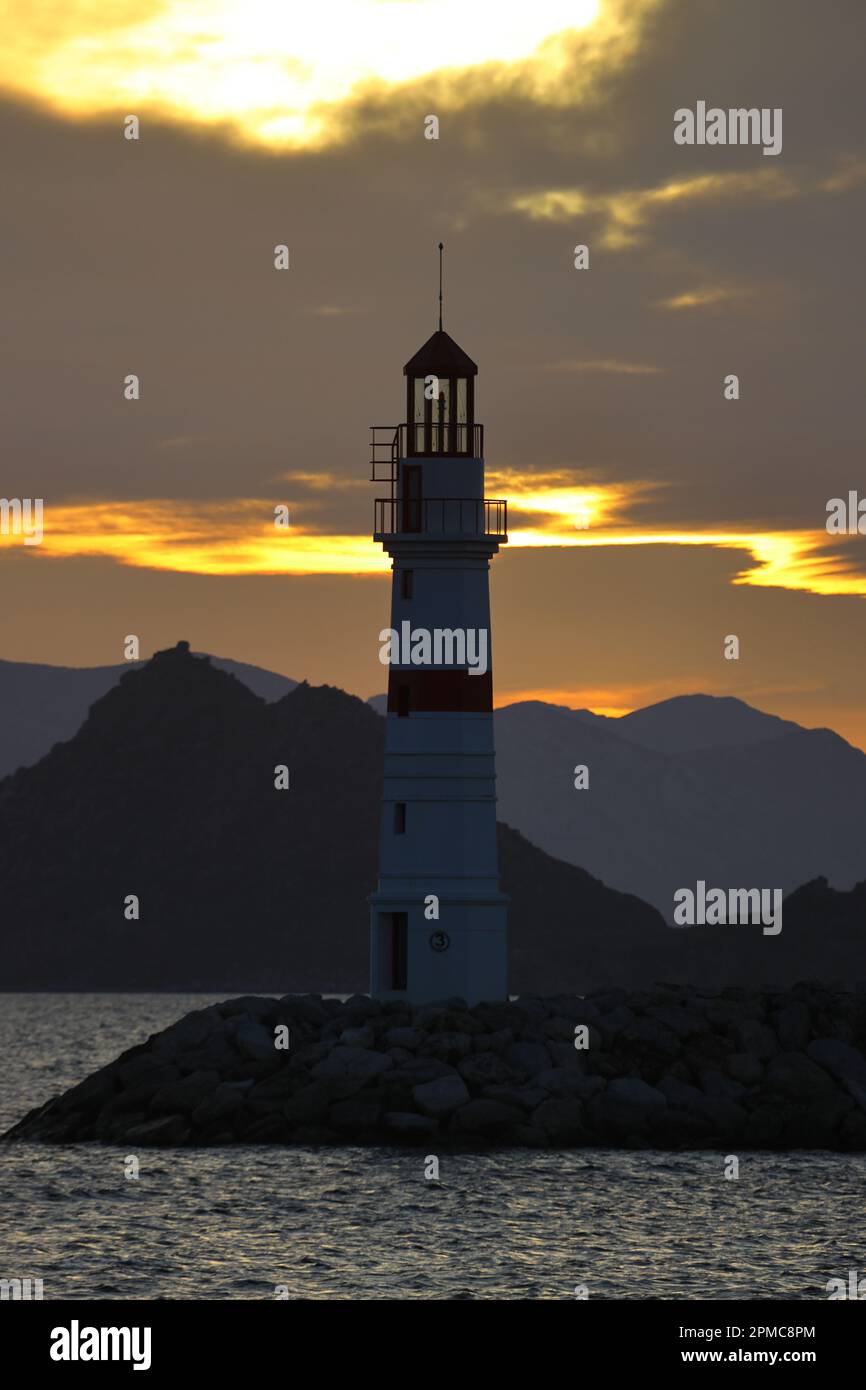 Seascape at sunshine. Lighthouse and sailings on the coast. Seaside ...