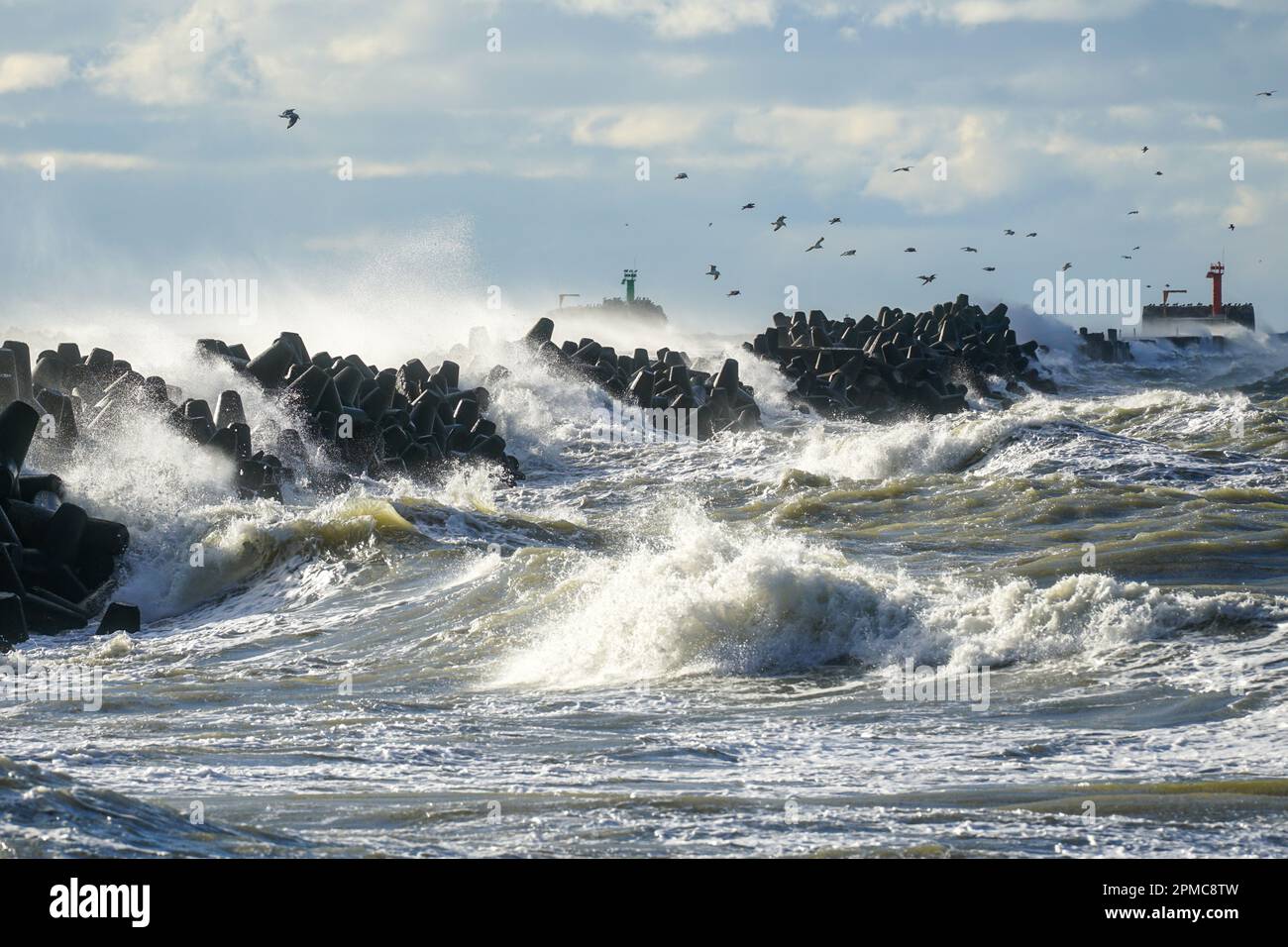 Coastal storm in the Baltic Sea, big waves crash against the concrete ...