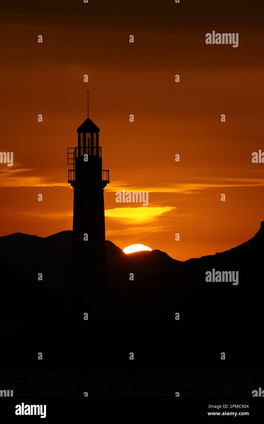 Seascape at sunshine. Lighthouse and sailings on the coast. Seaside ...