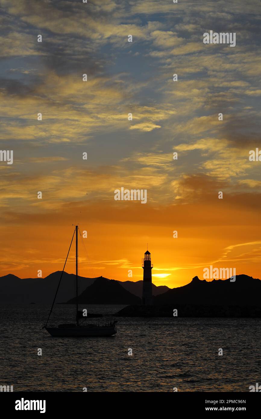 Seascape at sunshine. Lighthouse and sailings on the coast. Seaside ...