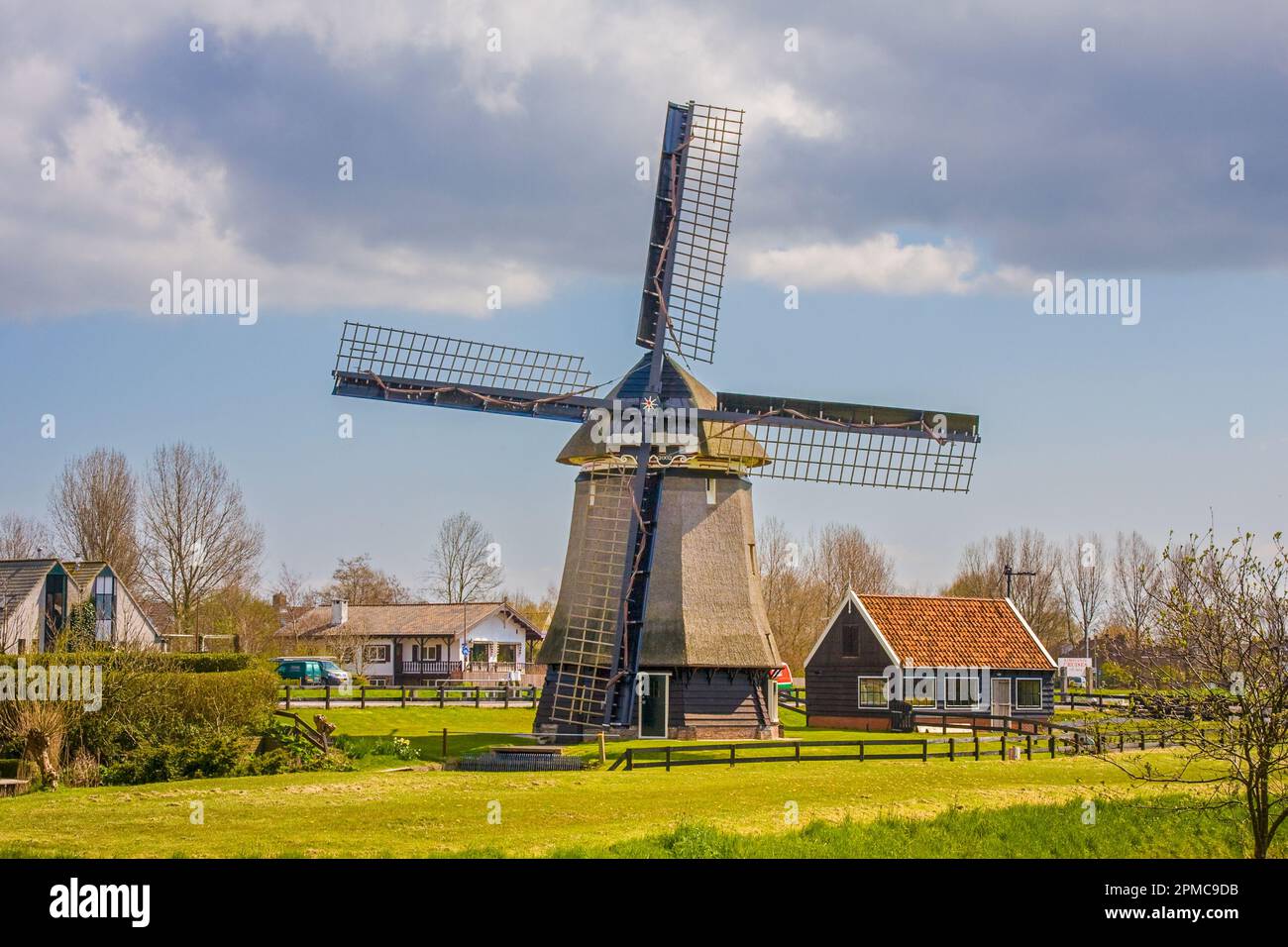 Windmill in village in North Holland (along the N9 highway), The ...