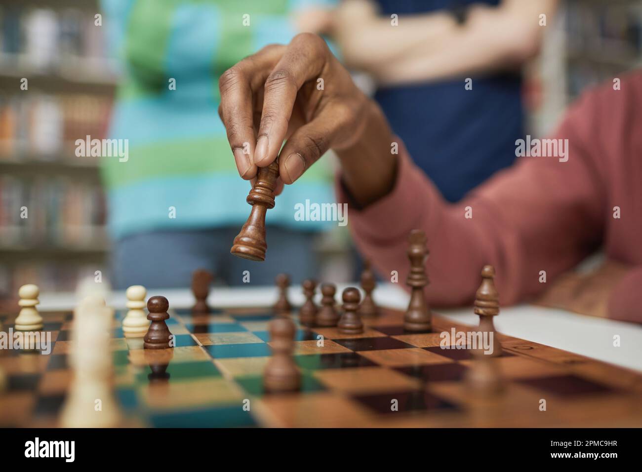 Black student playing chess hi-res stock photography and images - Alamy
