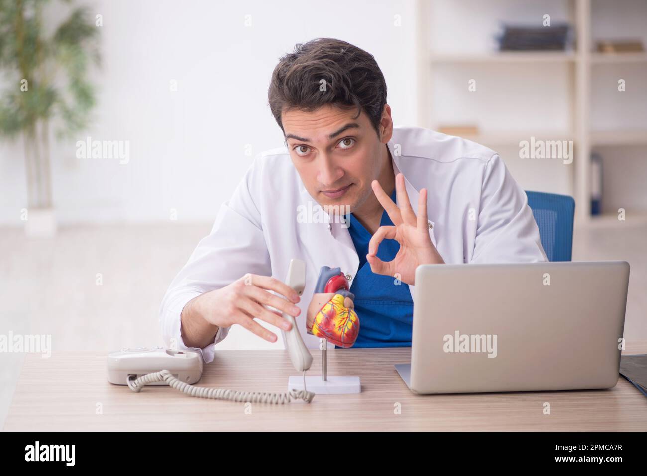 Young doctor cardiologist working at the hospital Stock Photo - Alamy