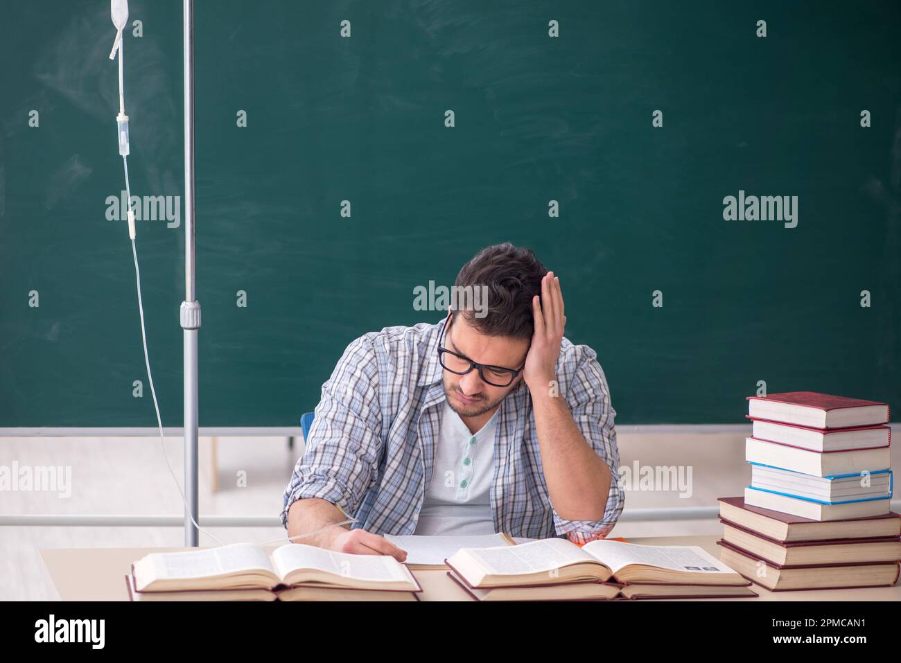 Young teacher suffering in the classroom Stock Photo - Alamy