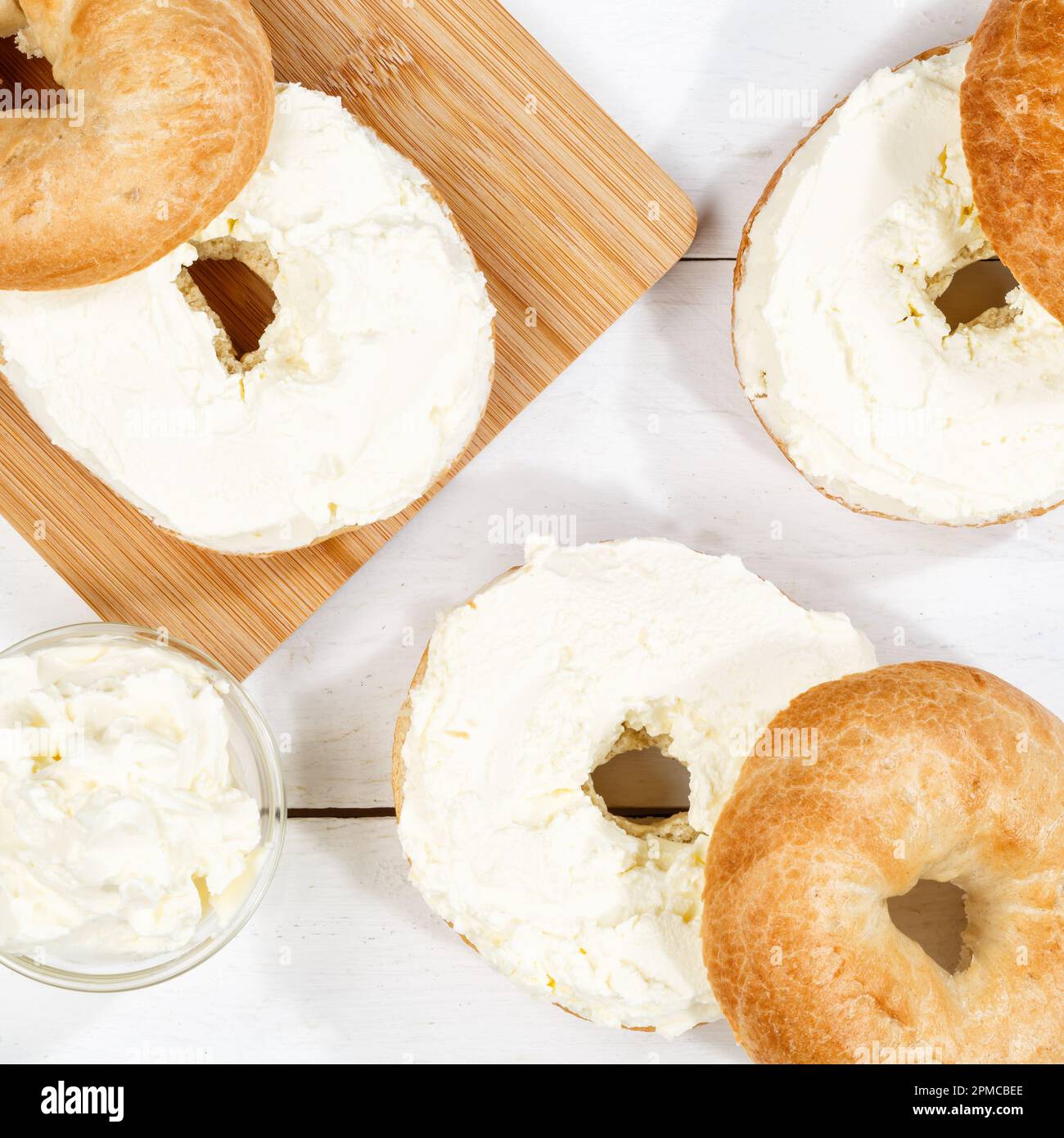 Bagel sandwich with fresh cream cheese for breakfast from above on a ...