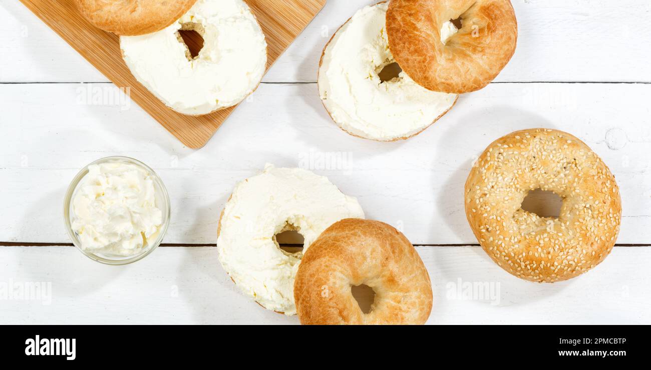 Bagel sandwich with fresh cream cheese for breakfast from above on a ...