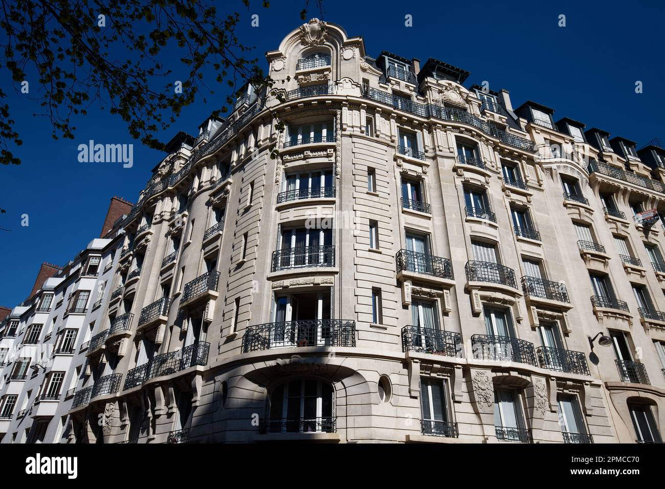 The facade of traditional French house with typical balconies and ...