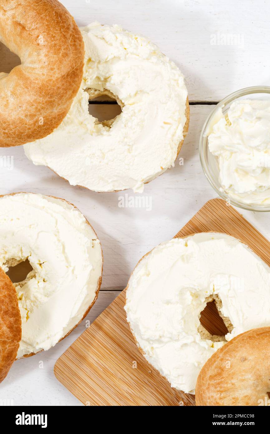 Bagel sandwich with fresh cream cheese for breakfast from above on a ...