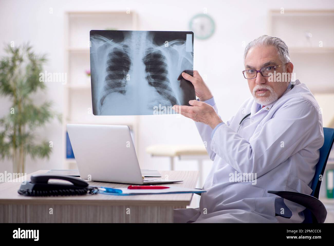 Old doctor radiologist working at the hospital Stock Photo - Alamy