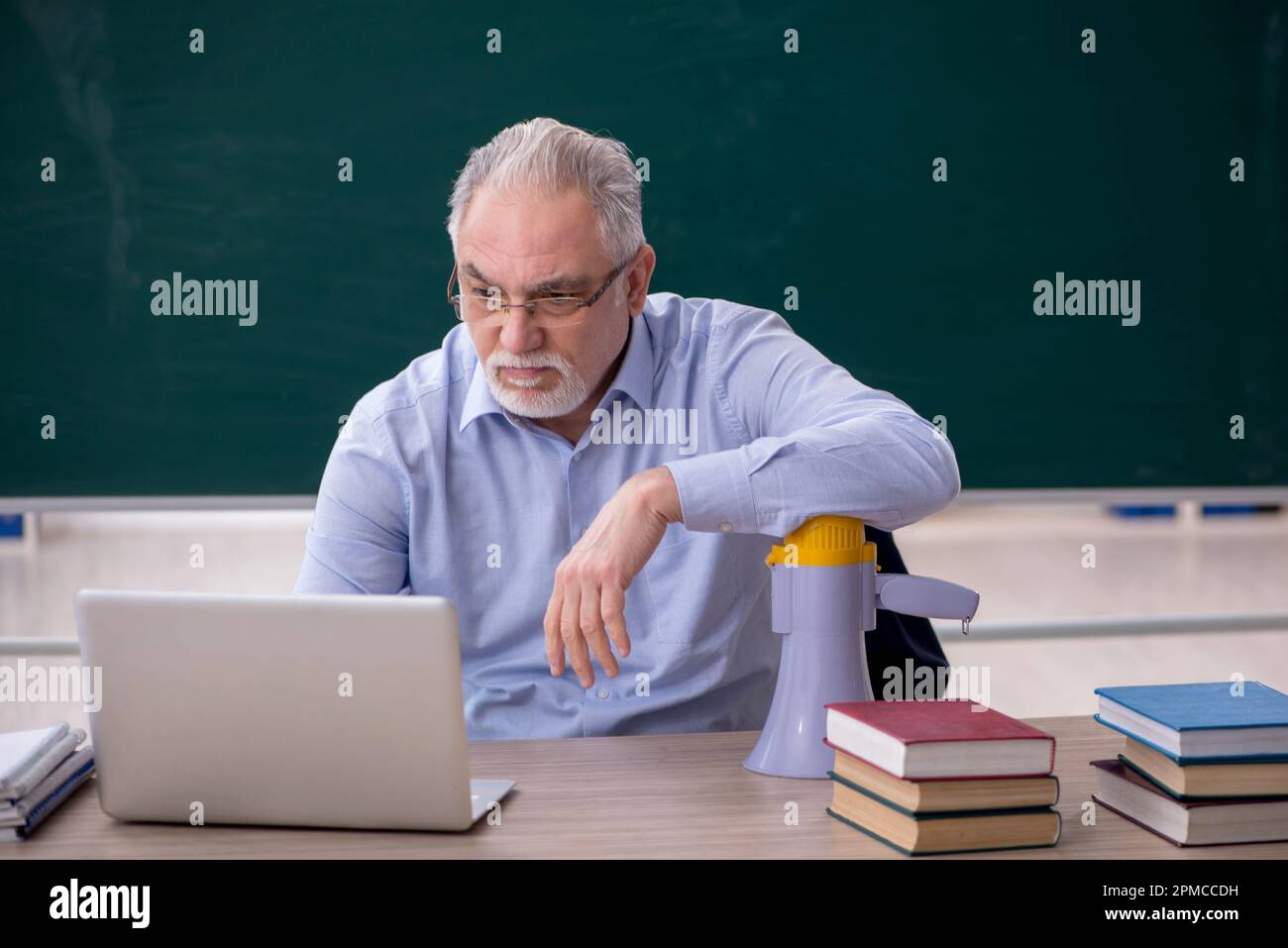 Old teacher in the classroom Stock Photo - Alamy