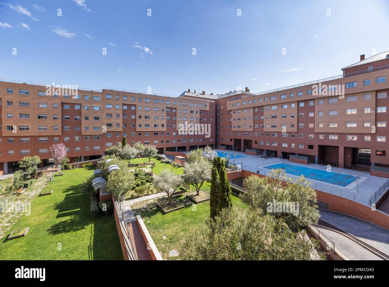 Interior patio facades of buildings in a common area with trees ...