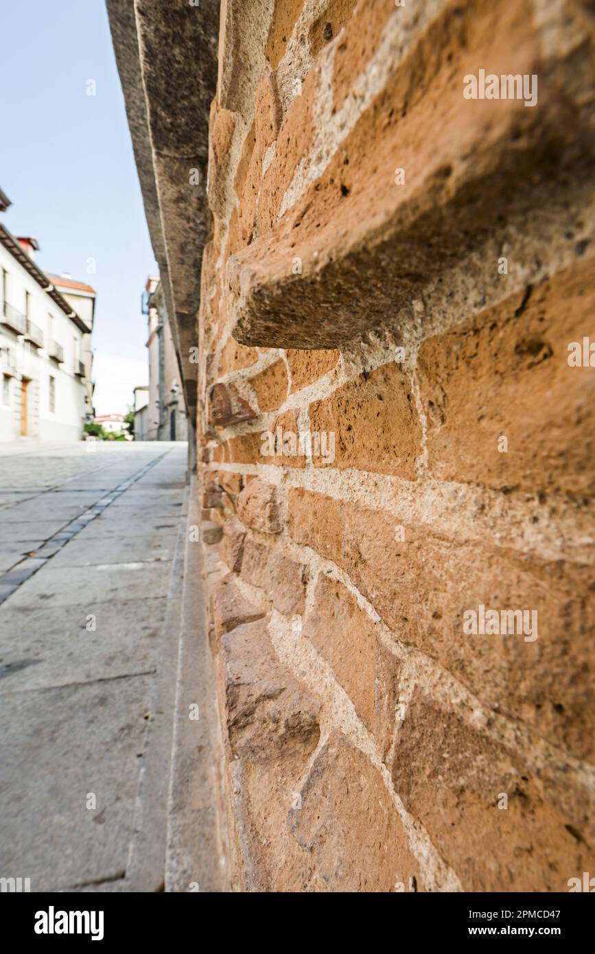 Very old and worn clay bricks on a wall in a Vintage neighborhood of ...