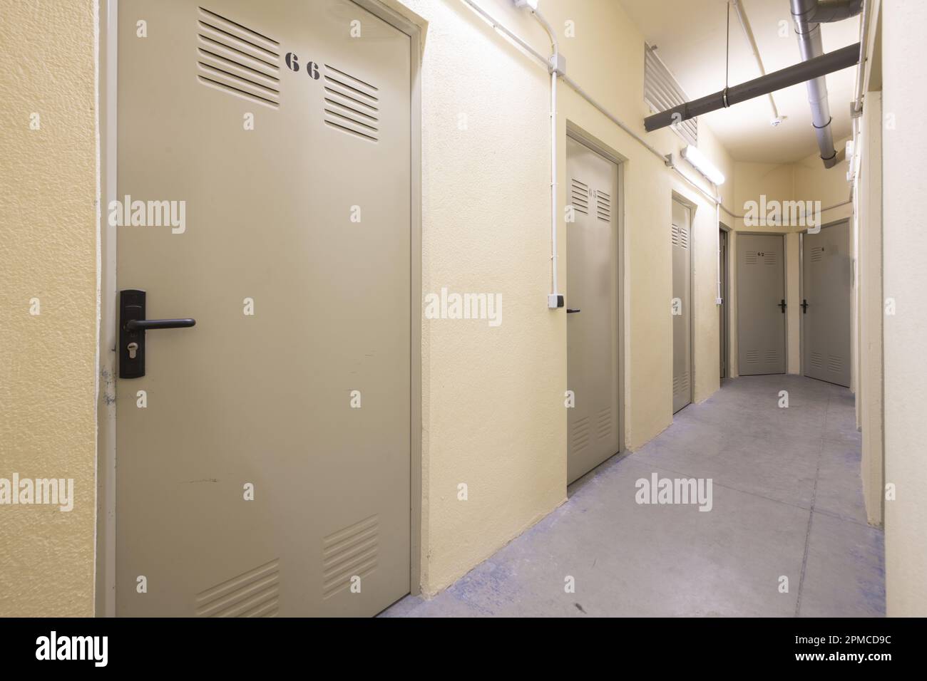 Closed numbered doors of storage rooms of a residential housing ...