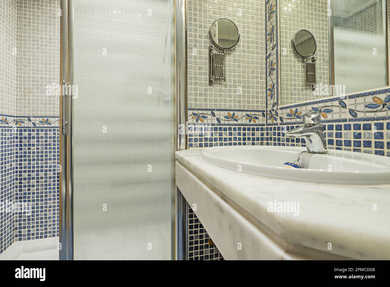 Bathroom with marble sink, mirror integrated into the wall with a ...