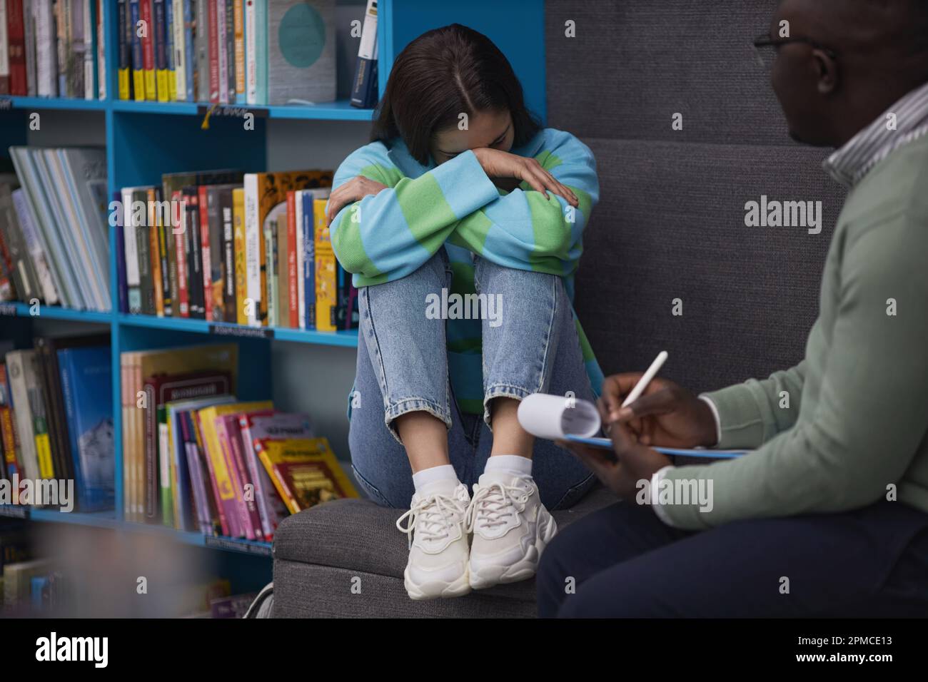 Portrait of stressed teenage girl crying in mental health therapy ...