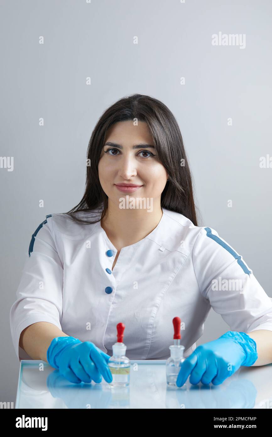 Doctor using pipette taking hi-res stock photography and images - Alamy
