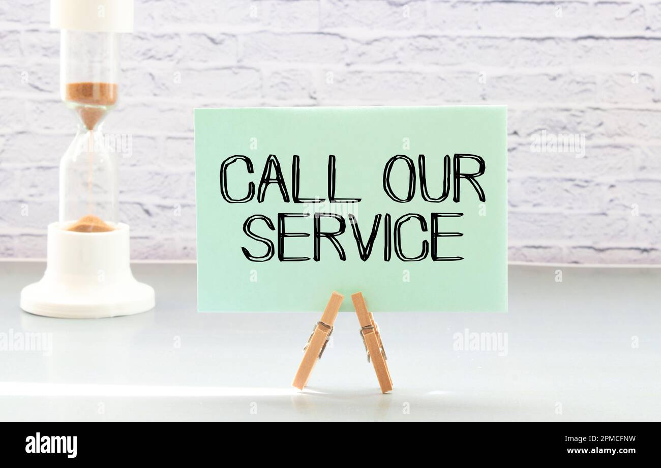 Our services symbol. Old blue rotary dial telephone. Words 'our ...