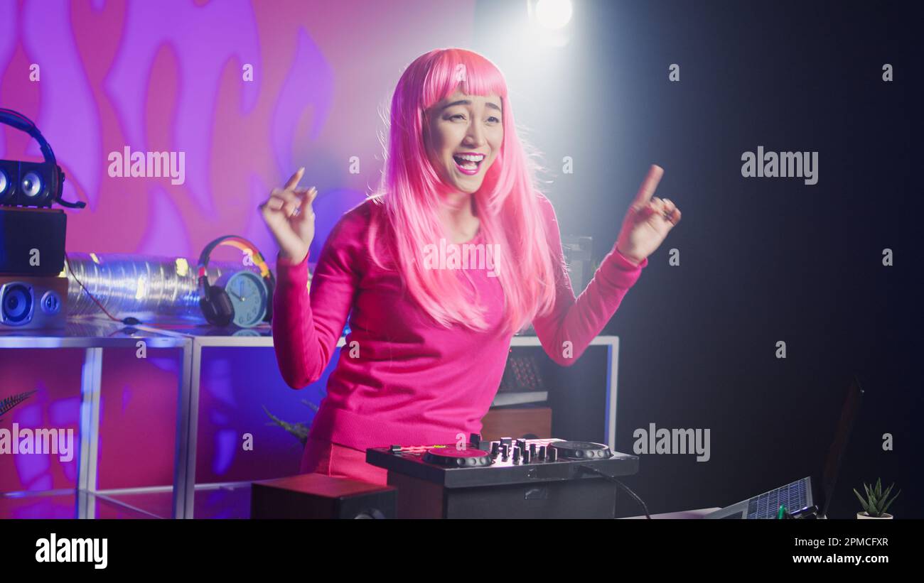 Dj artist using professional mixer console in nightclub, mixing techno ...