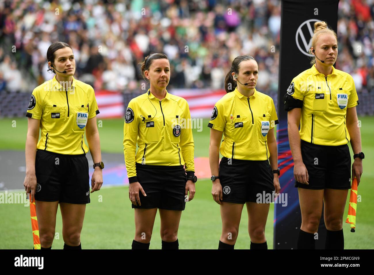 FIFA referees line up for the team anthems before the first half of a ...
