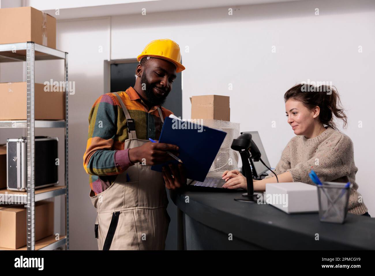 African american employee analyzing goods inventory report with ...