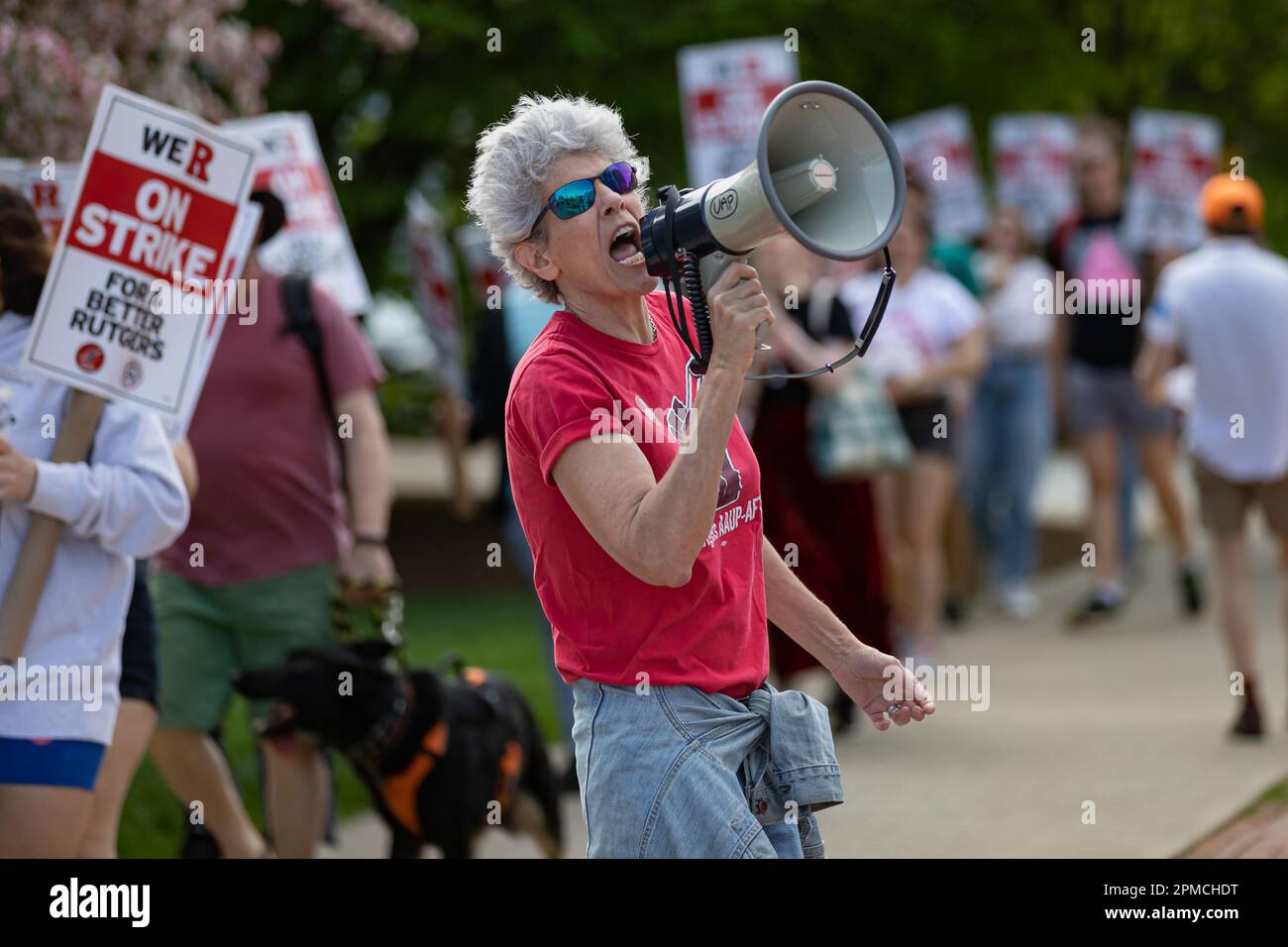 A protester with a bullhorn leads chants with Rutgers students and ...