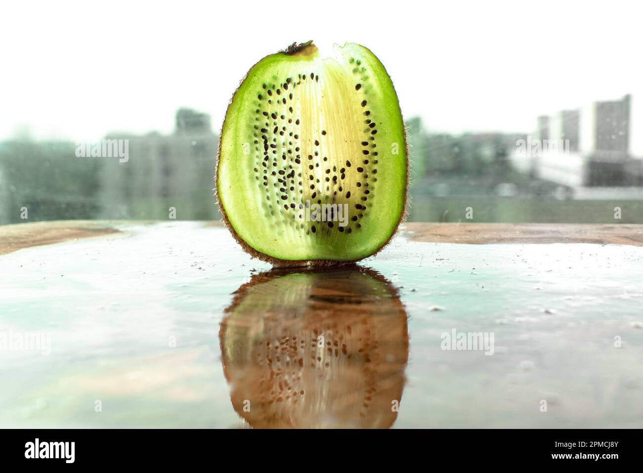 Close-up of a kiwi fruit with its vibrant green color. The texture ...