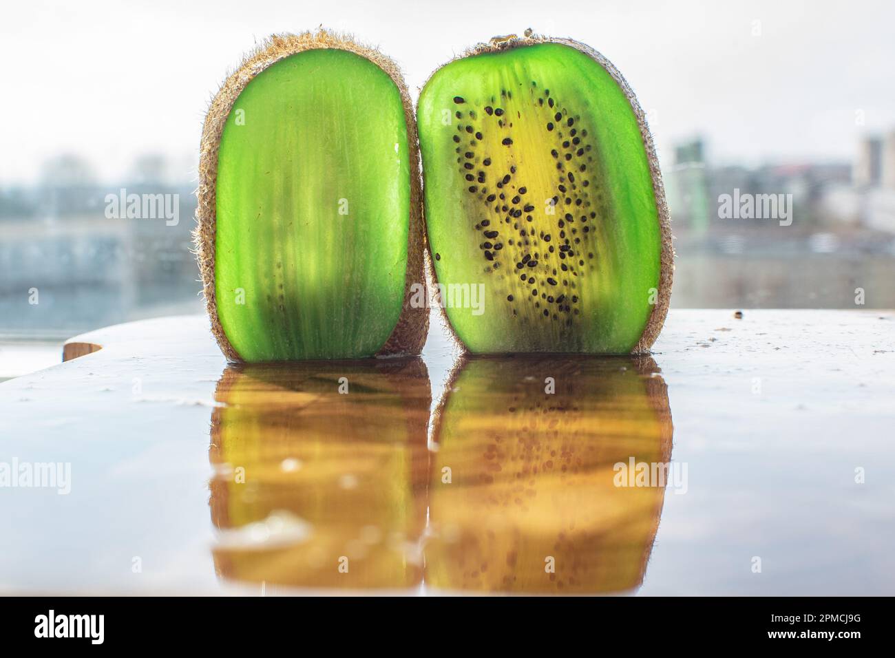 Close-up of a kiwi fruit with its vibrant green color. The texture ...