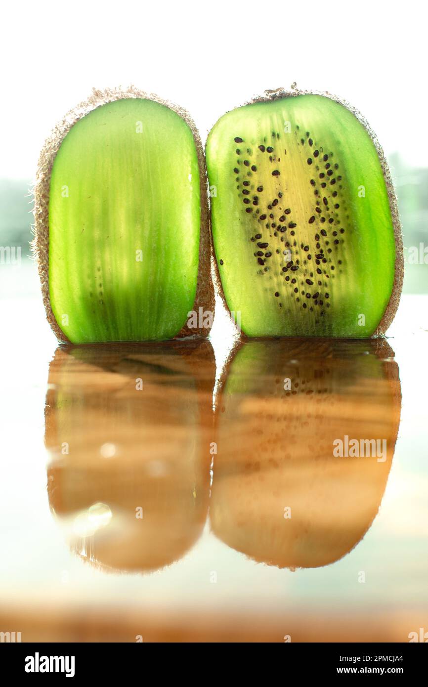 Close-up of a kiwi fruit with its vibrant green color. The texture ...