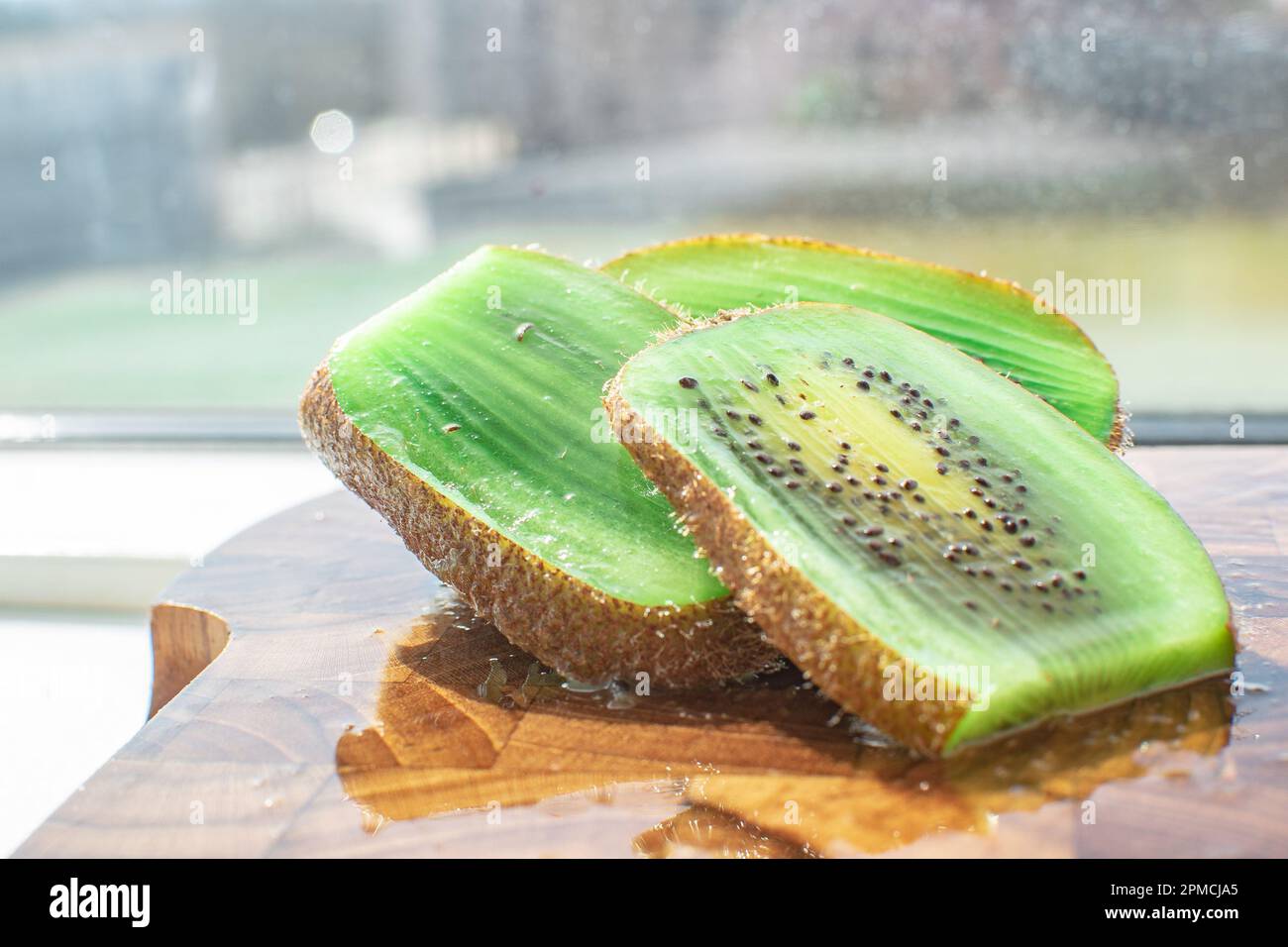 Close-up of a kiwi fruit with its vibrant green color. The texture ...